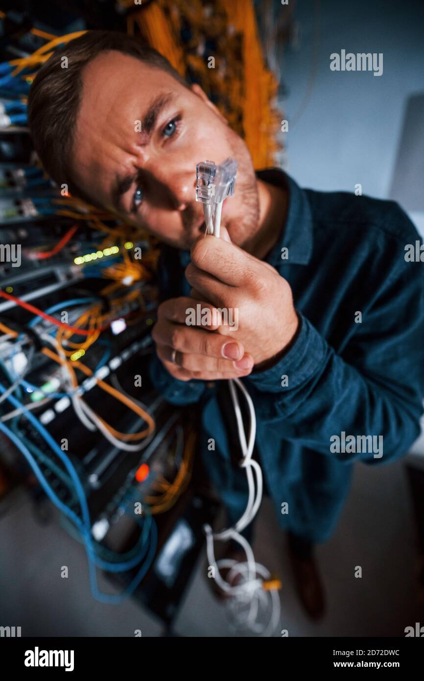 Close up view of funny man with internet wires in server room Stock ...