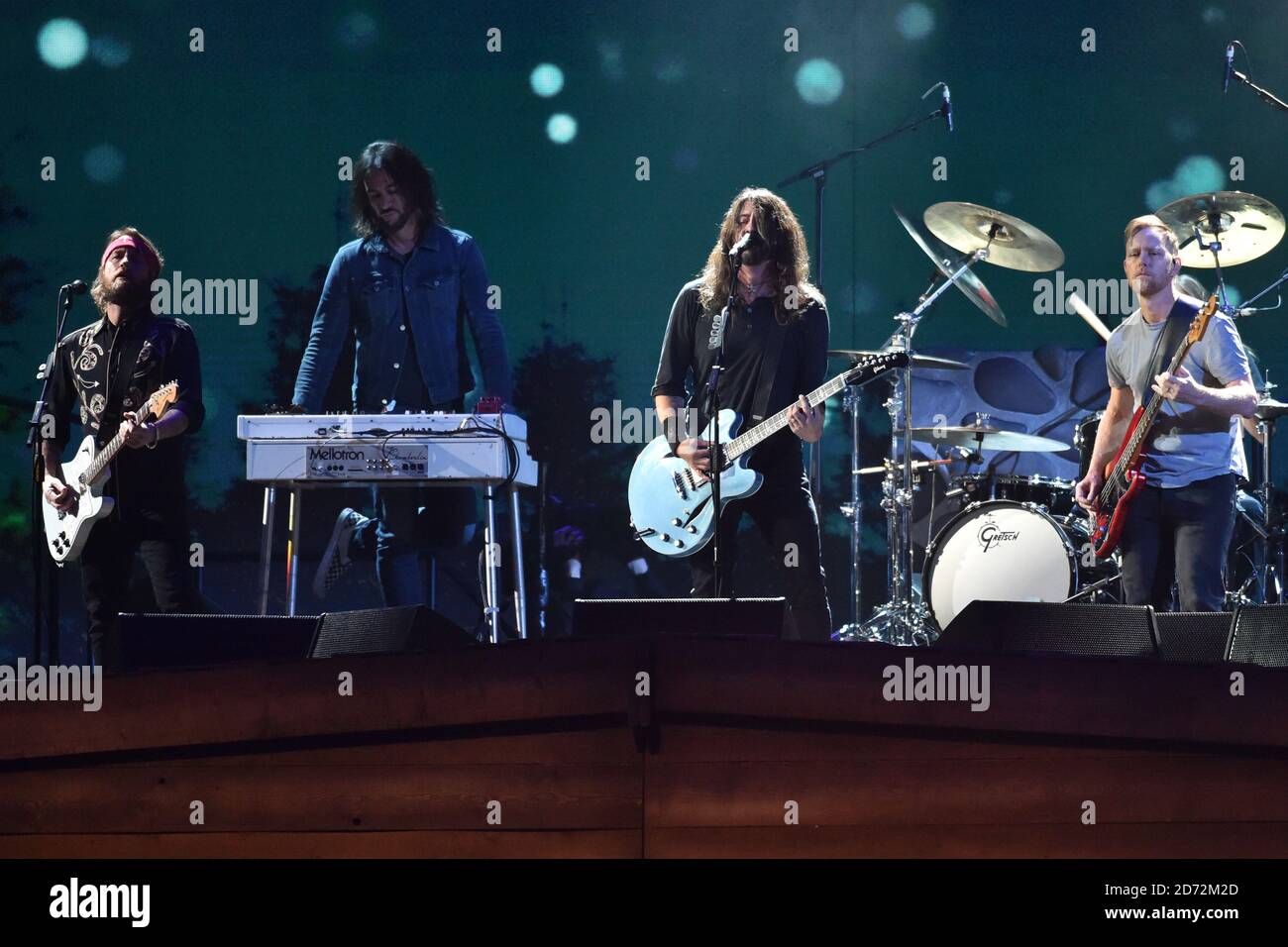 EDITORIAL USE ONLY. Foo Fighters perform on stage at the Brit Awards at ...