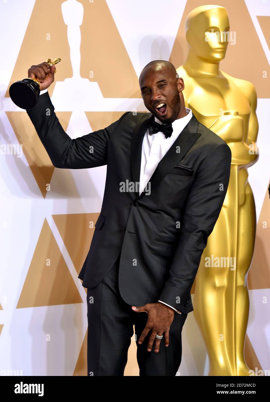 Kobe Bryant with his Best animated short Oscar for Dear Basketball in ...
