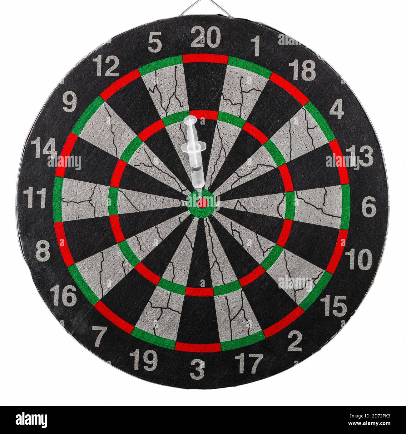 Disposable syringe in the bull's eye of the dart board. Correctly ...