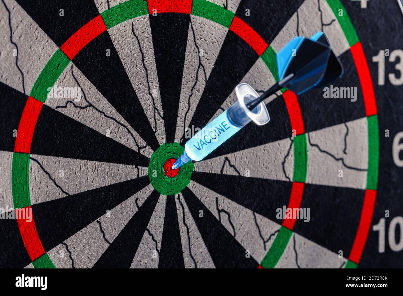 A disposable syringe in the form of a dart with the inscription Vaccine ...