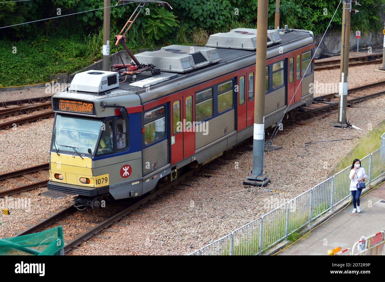 MTR light rail vehicle next to Tuen Mun Park, Hong Kong Stock Photo - Alamy