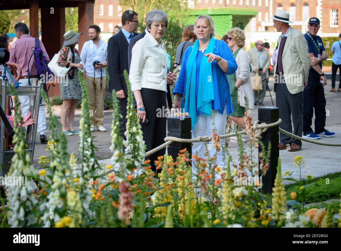 Prime Minister Theresa May, husband Philip and RHS director Sue Biggs ...