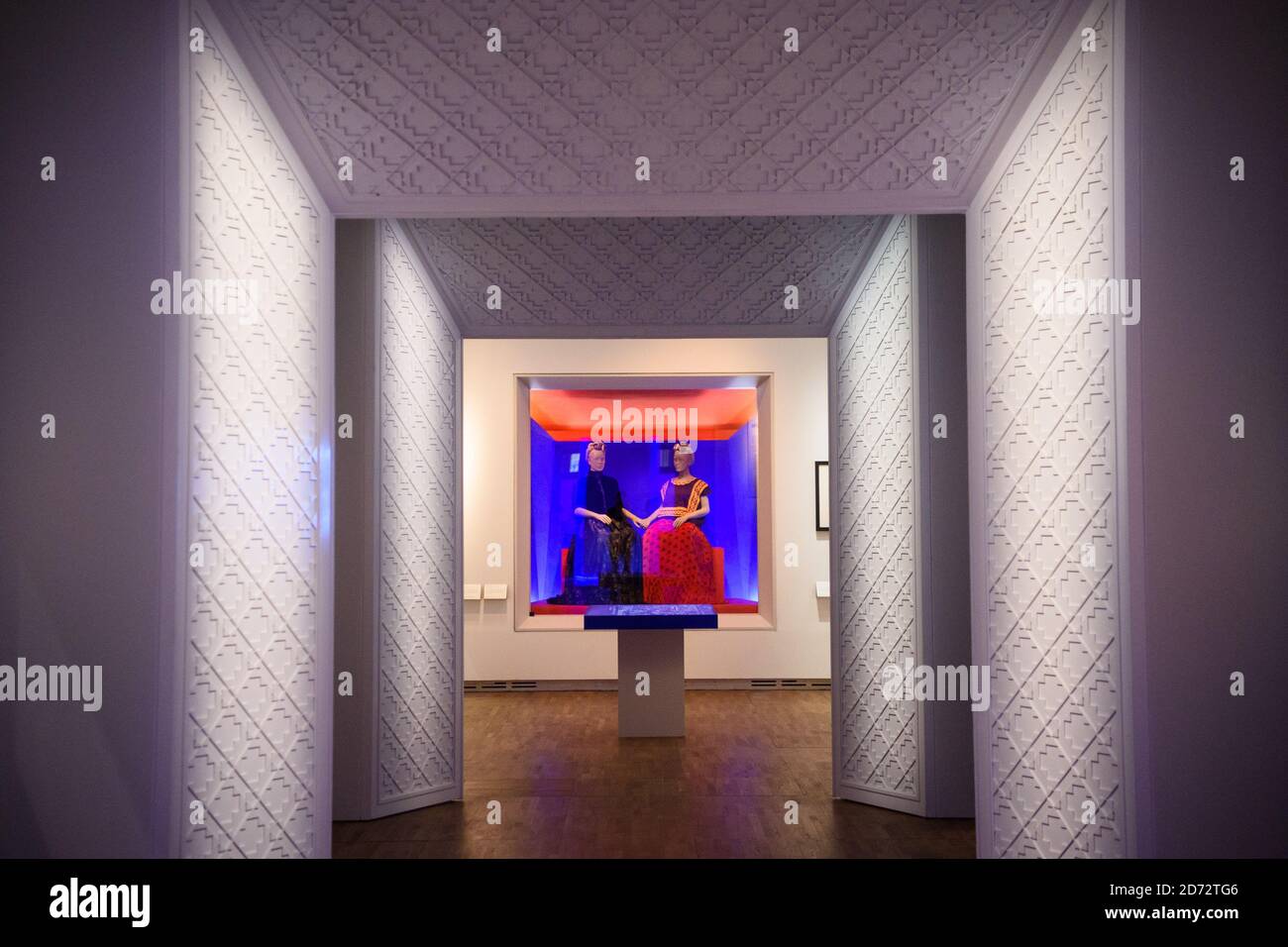 Visitors look at artworks and personal artefacts owned by Frida Kahlo ...