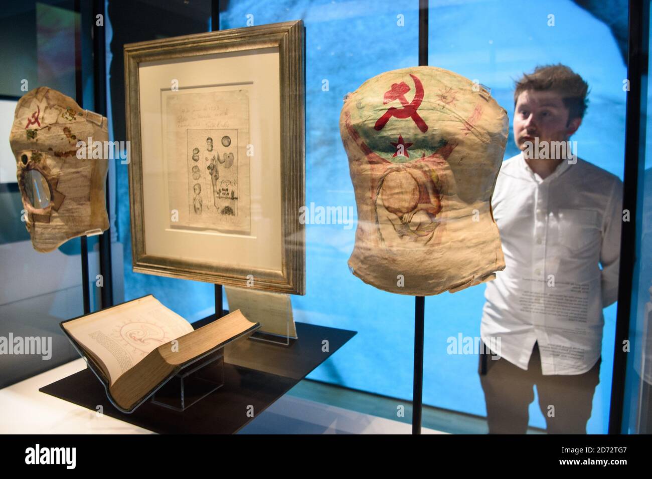 Visitors look at medical corsets owned by Frida Kahlo, part of the ...