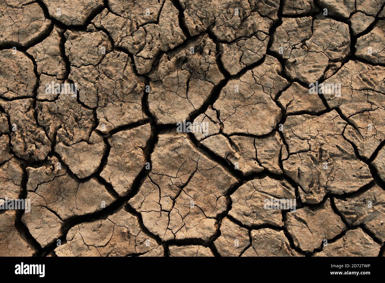 Soil cracked background Stock Photo - Alamy