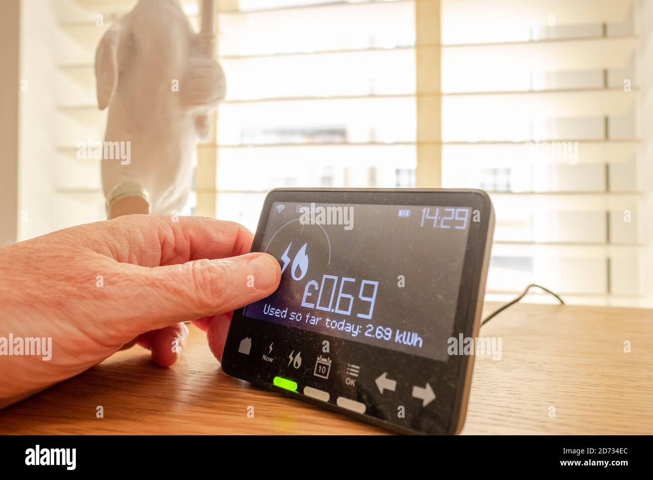 Adult homeowner seen selecting a Smart Meter mode on his electricity ...