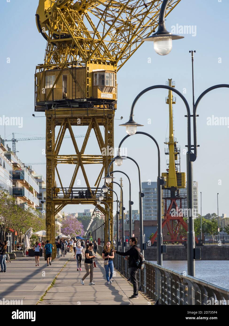 The old cranes at the old docks. Puerto Madero, the modern living ...