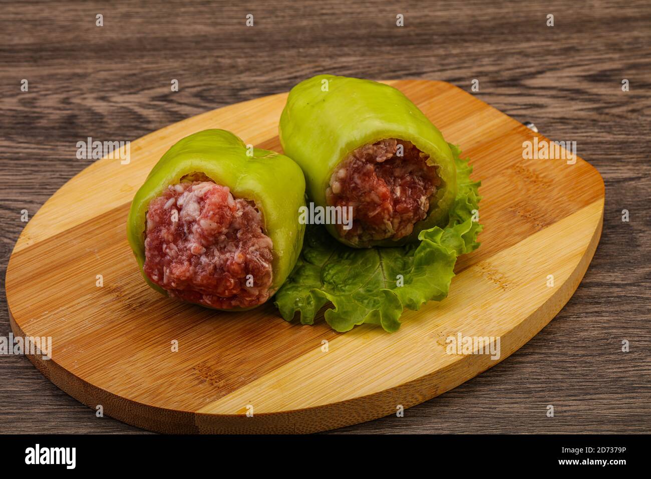 Raw stuffed green bell pepper with meat Stock Photo - Alamy