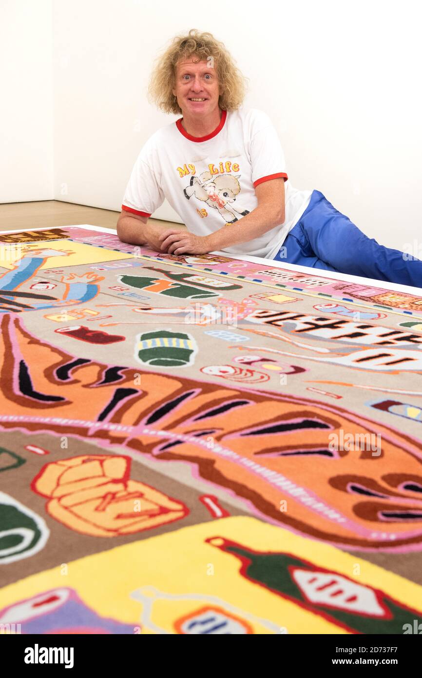 Artist Grayson Perry pictured with his work 'Don't Look Down', at the ...