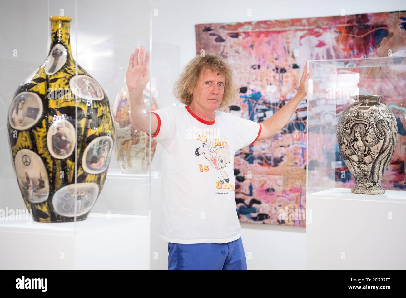 Artist Grayson Perry pictured with several of his ceramic works, at the ...