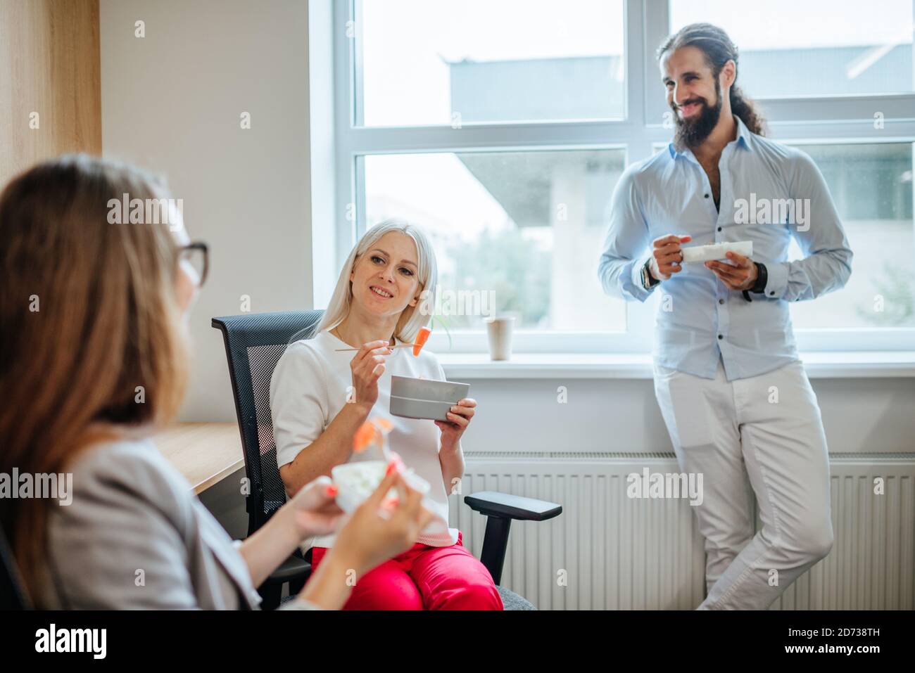 Business people having their lunch in office Stock Photo - Alamy