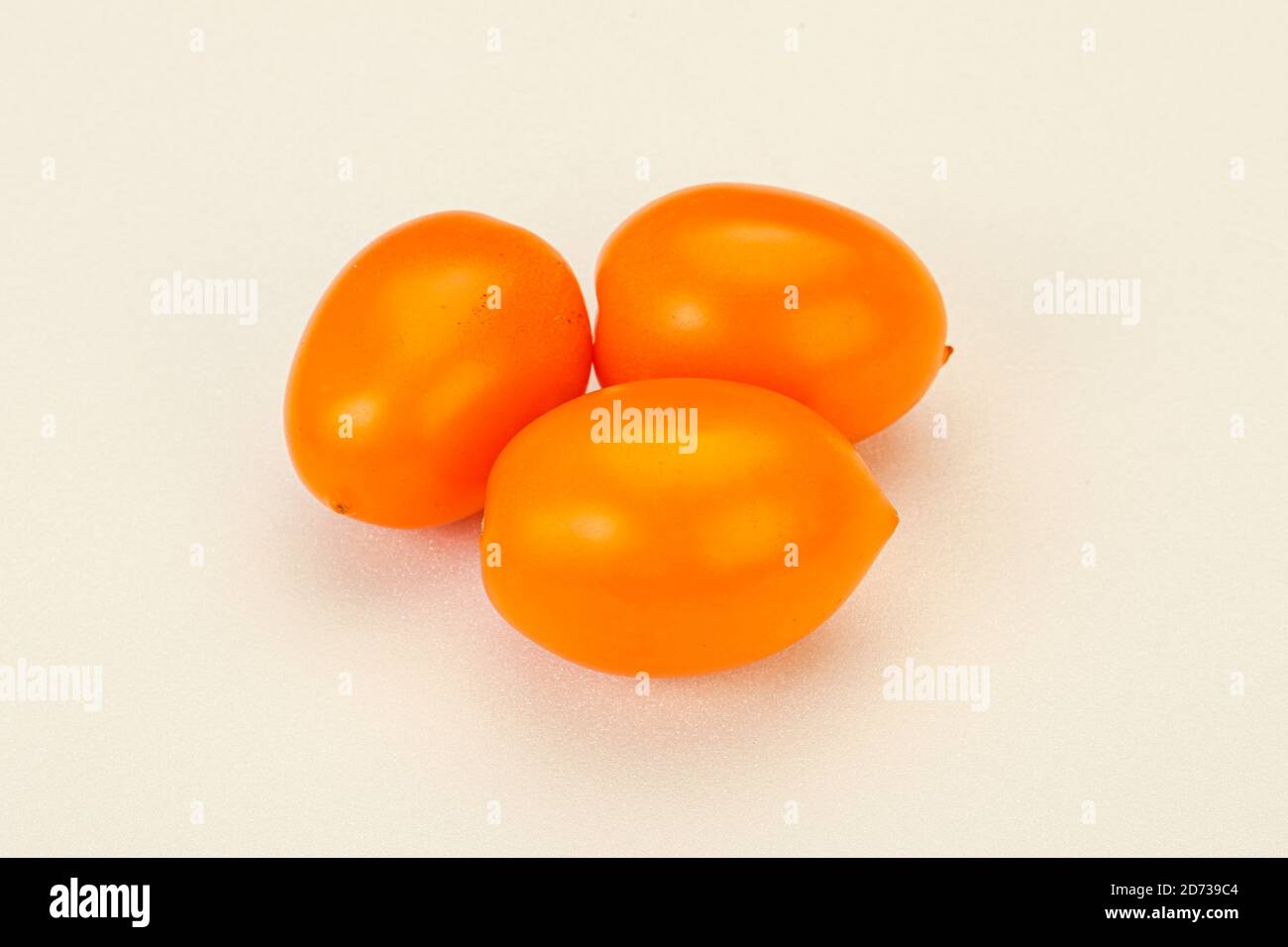 Tasty vegetables - Yellow tomato heap over background Stock Photo - Alamy