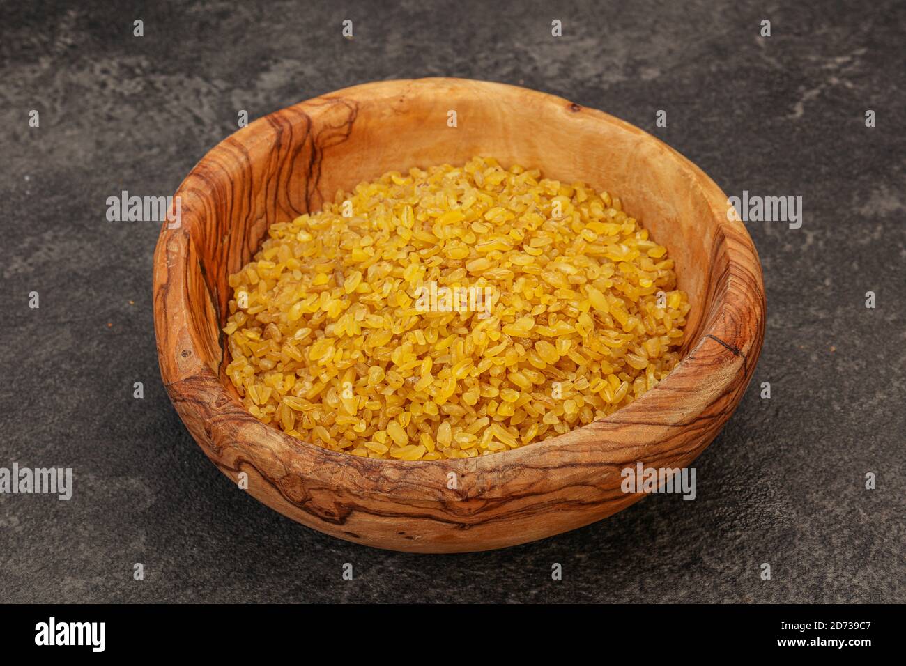 Vegetarian cuisine - dry bulgur for cooking in the bowl Stock Photo - Alamy
