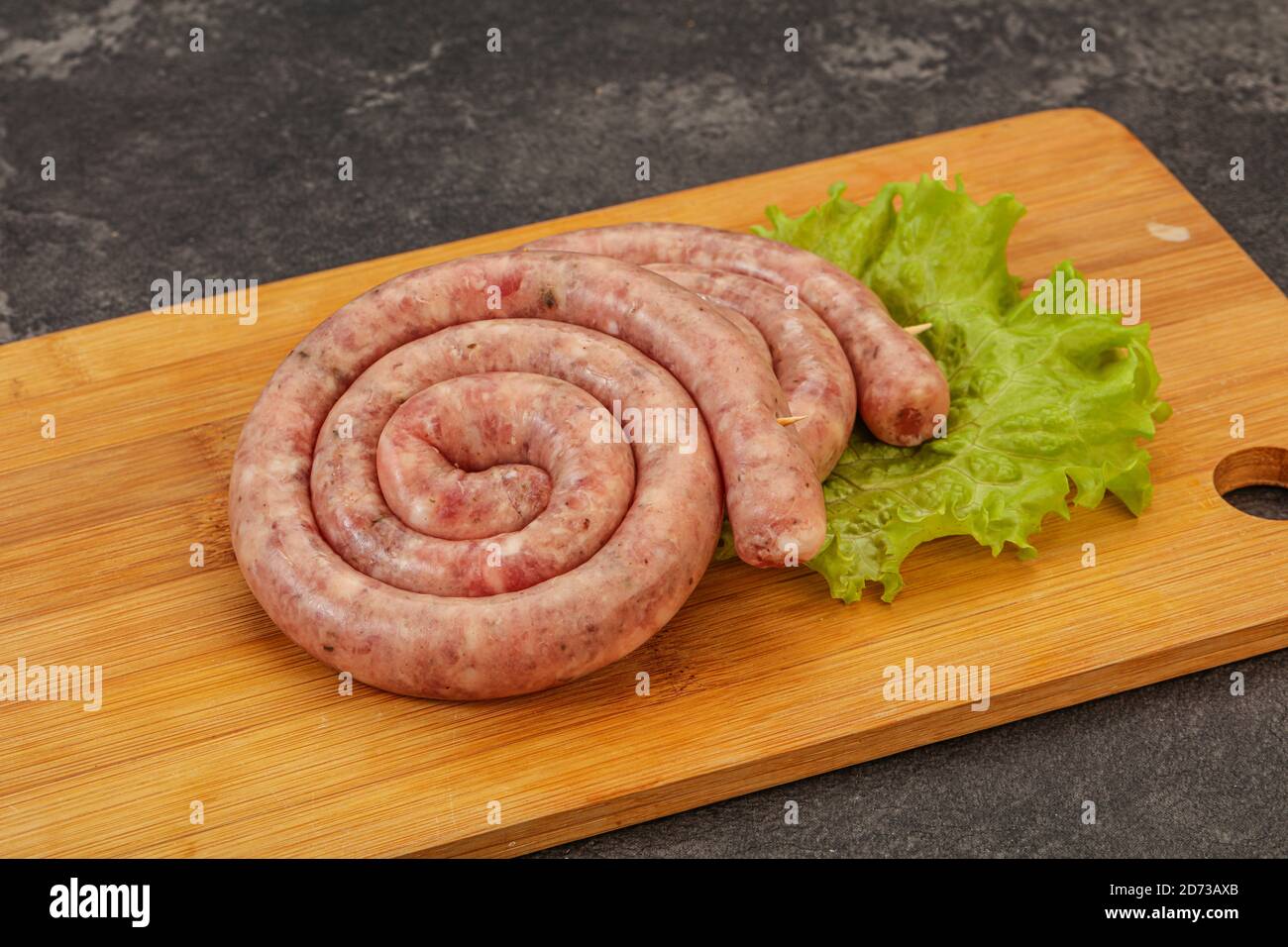Raw pork sausage ring for grill Stock Photo - Alamy