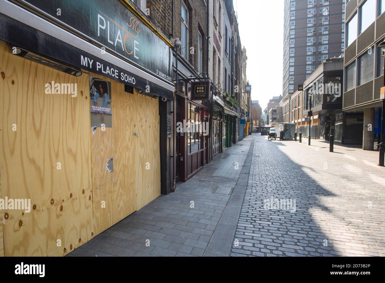 Empty streets and boarded up shops and restaurants in Soho, London, as ...