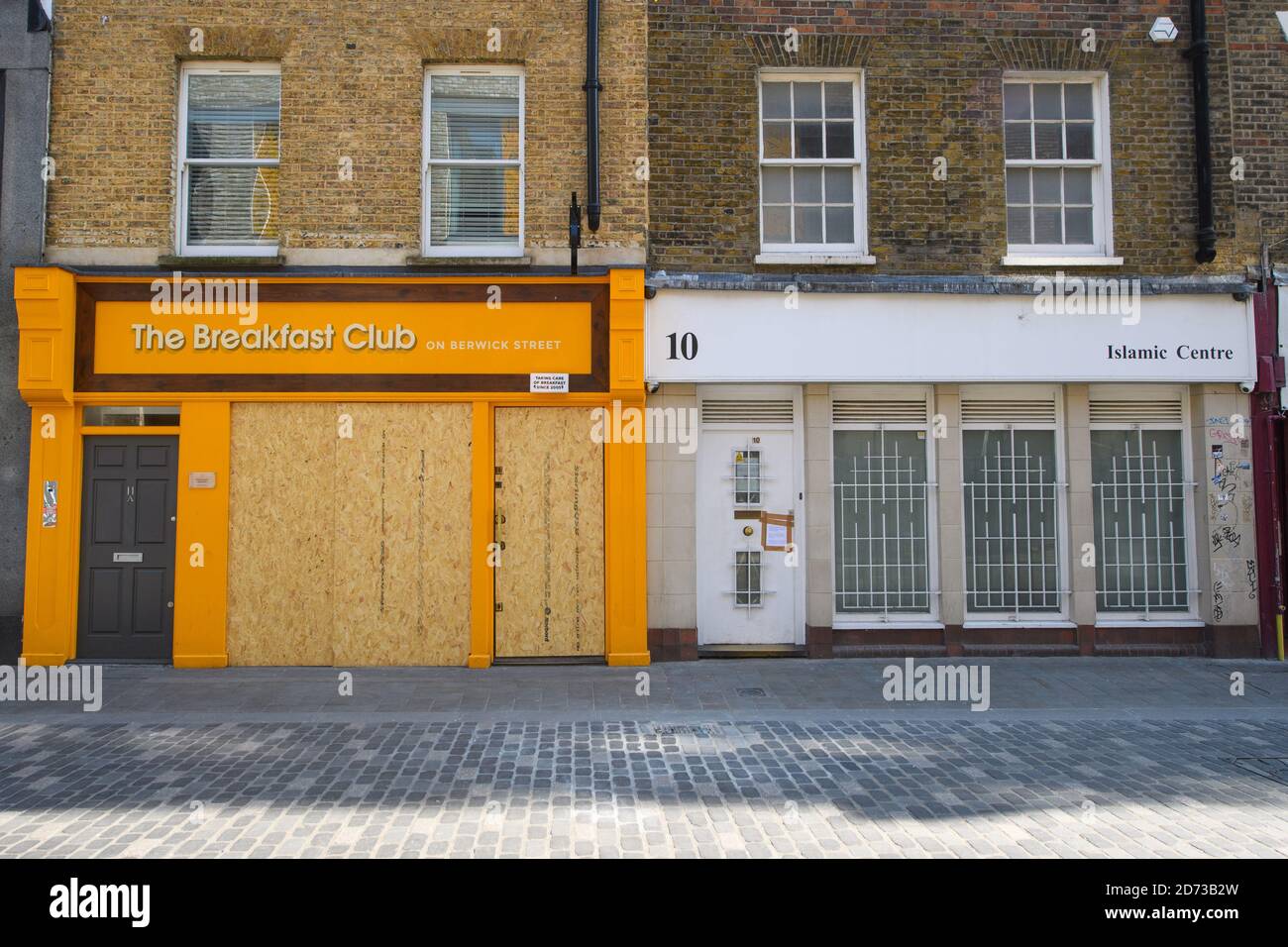 Empty streets and boarded up shops and restaurants in Soho, London, as ...