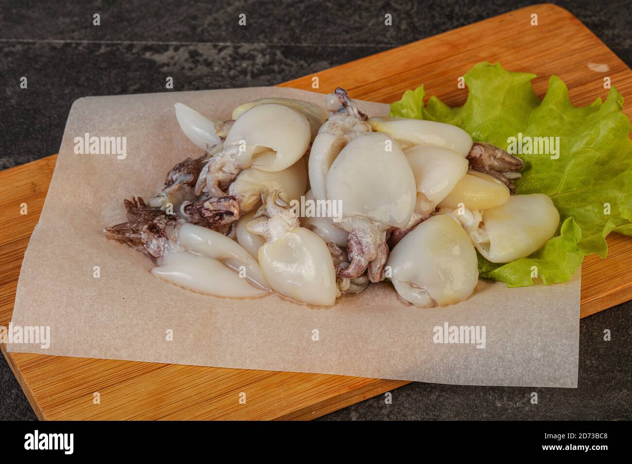 Raw seafood - cuttlefish for cooking over board Stock Photo - Alamy