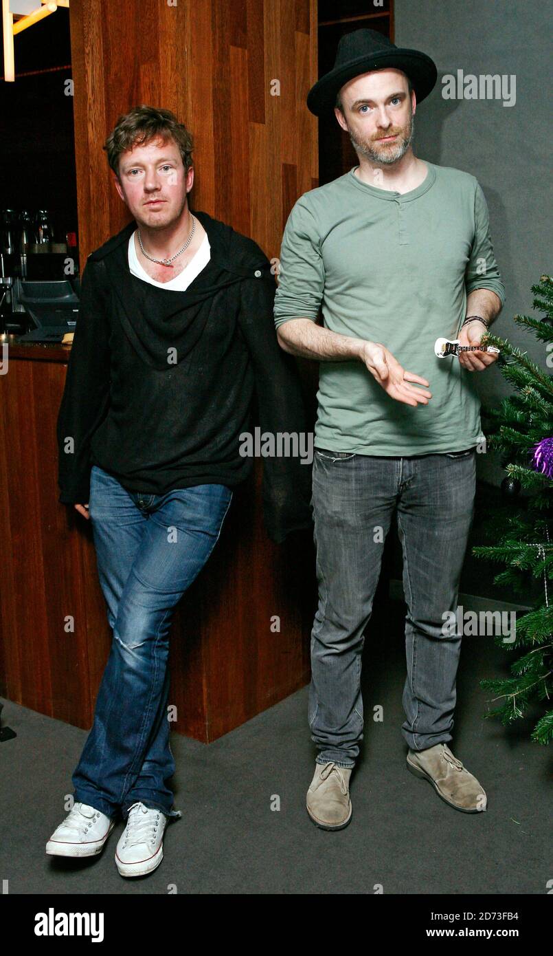 Andy Dunlop (left) and Fran Healey of Travis pose for photographs after ...