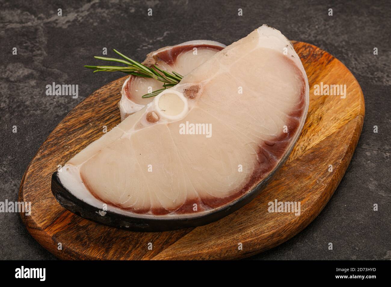 Raw shark steak served rosemary for cooking Stock Photo - Alamy