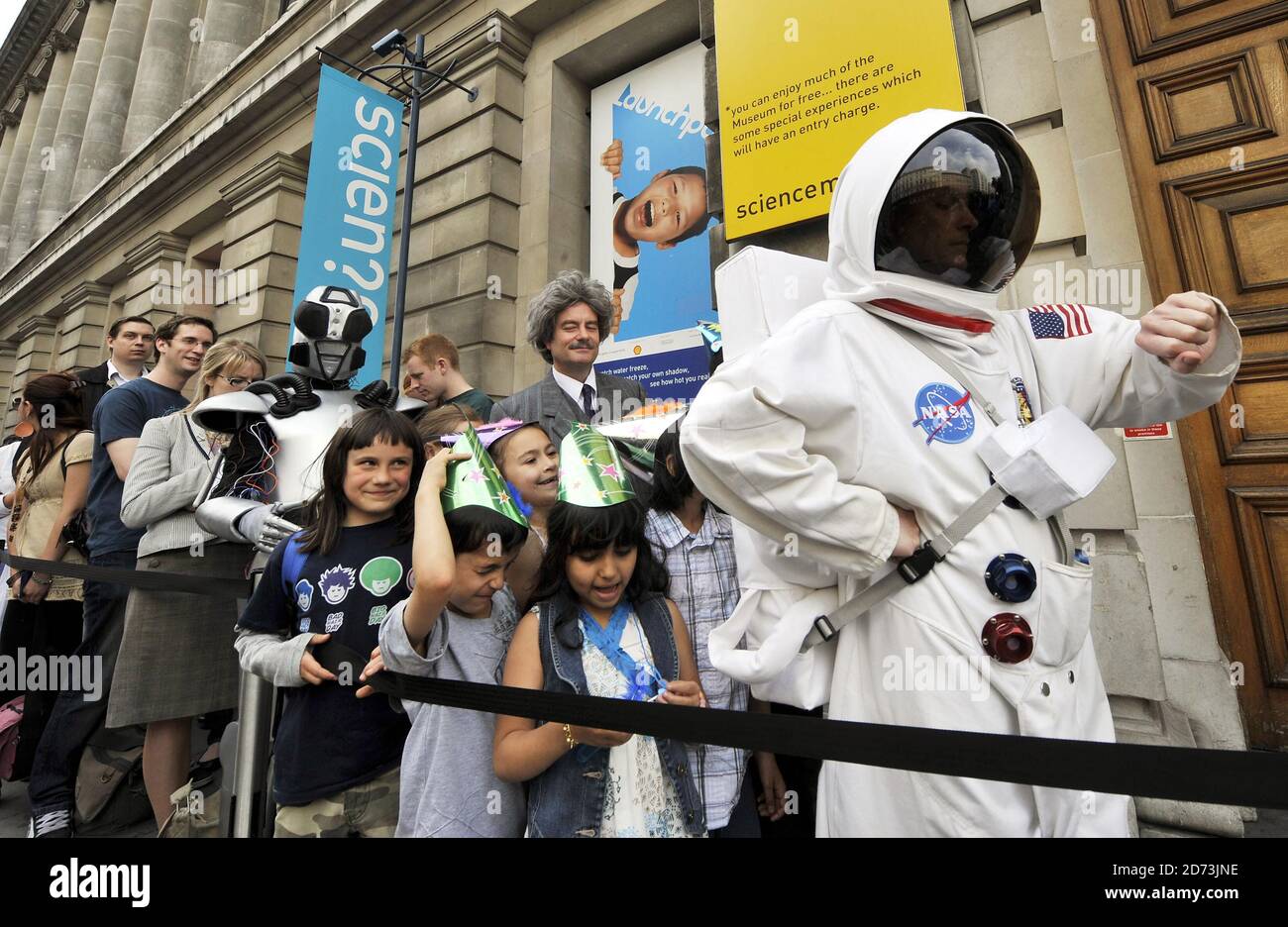 Children play with a robot during a Centenary celebrations event at the ...