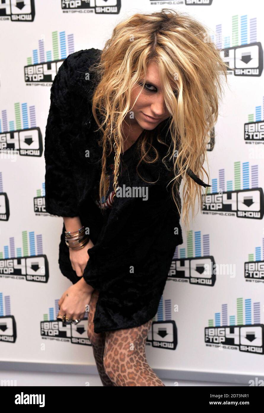 American singerÃ songwriter KeSha poses for photographs after being ...