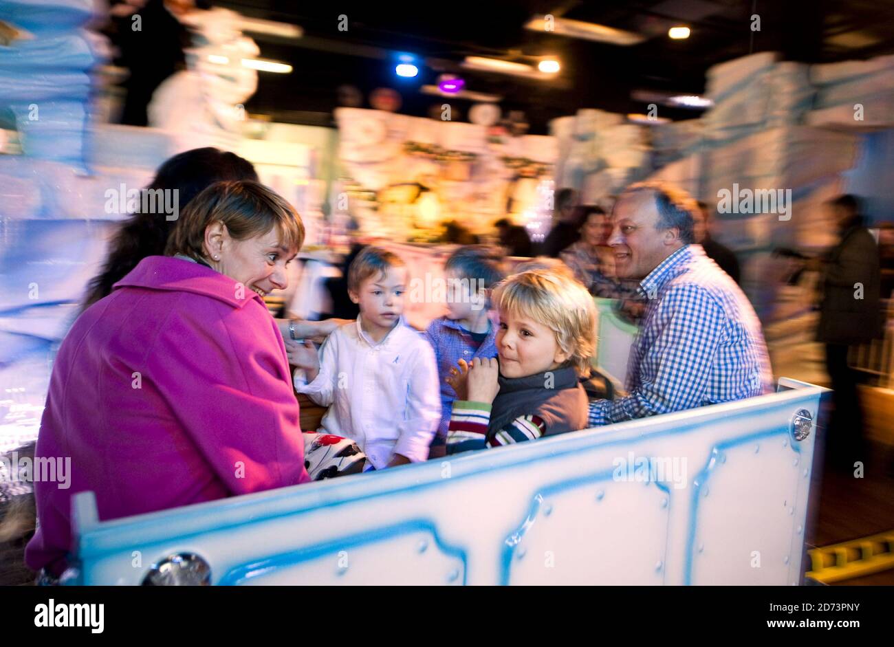 Parents and children ride the mini train in Selfridge's Grotto as the ...
