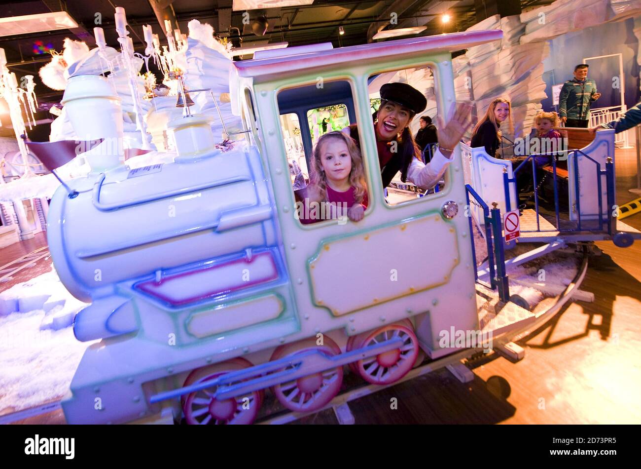Parents and children ride the mini train in Selfridge's Grotto as the ...