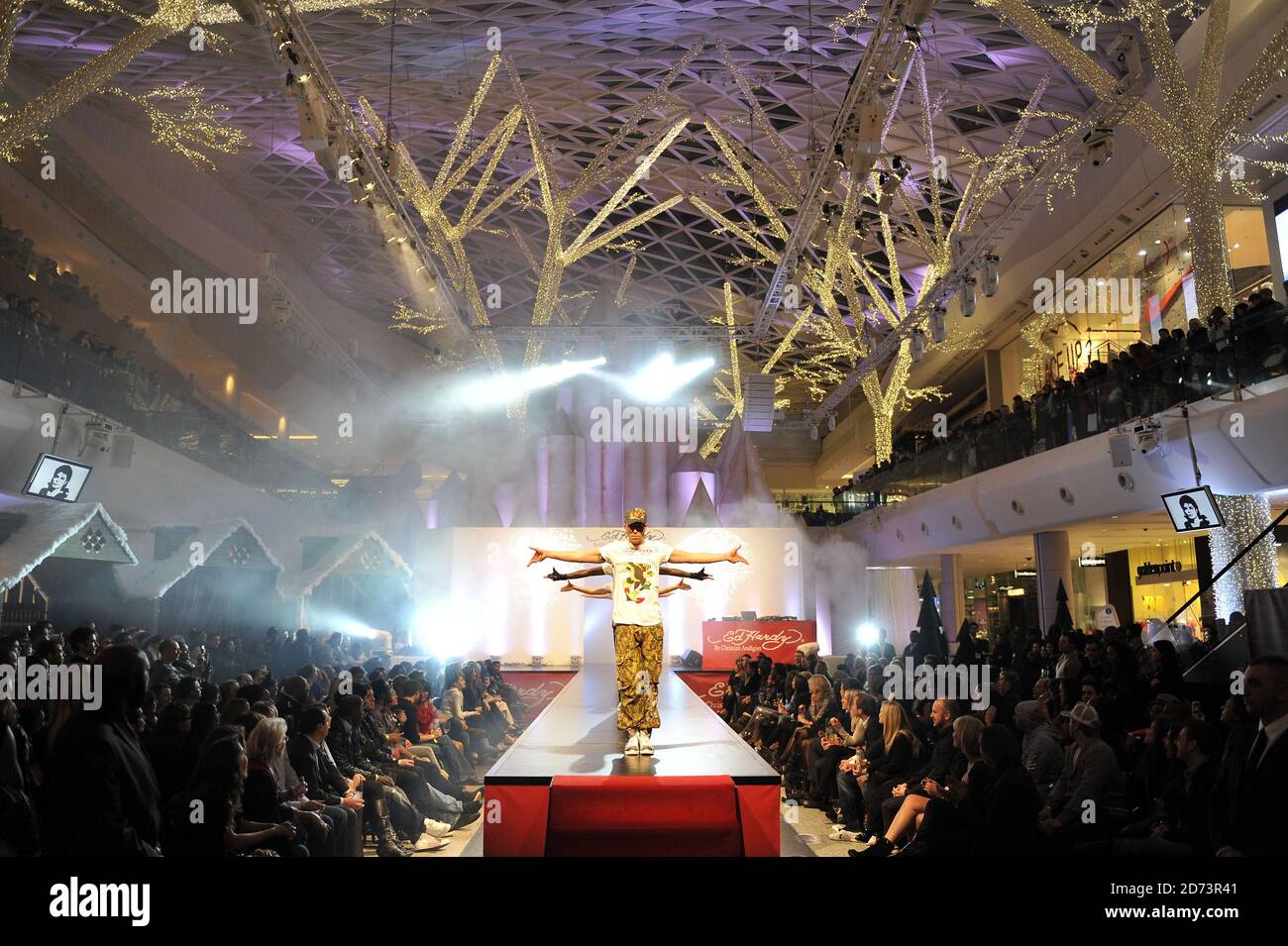 Models on the catwalk during the launch of the new Ed Hardy store in ...