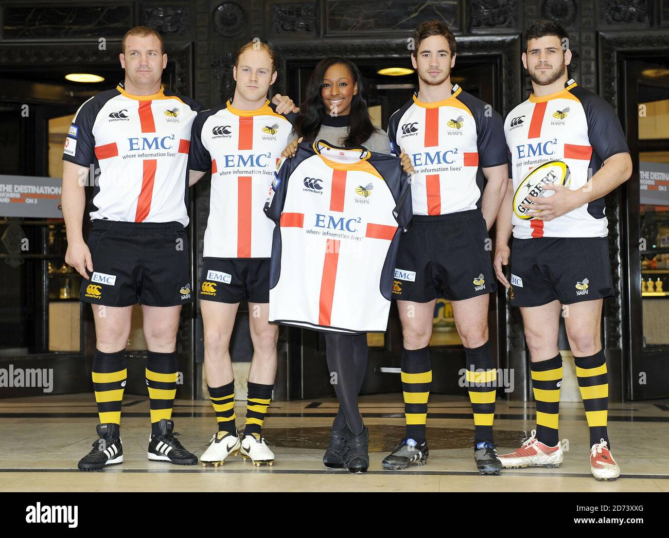 Alexandra Burke (centre) poses for photographs with (l-r) Tim Payne ...