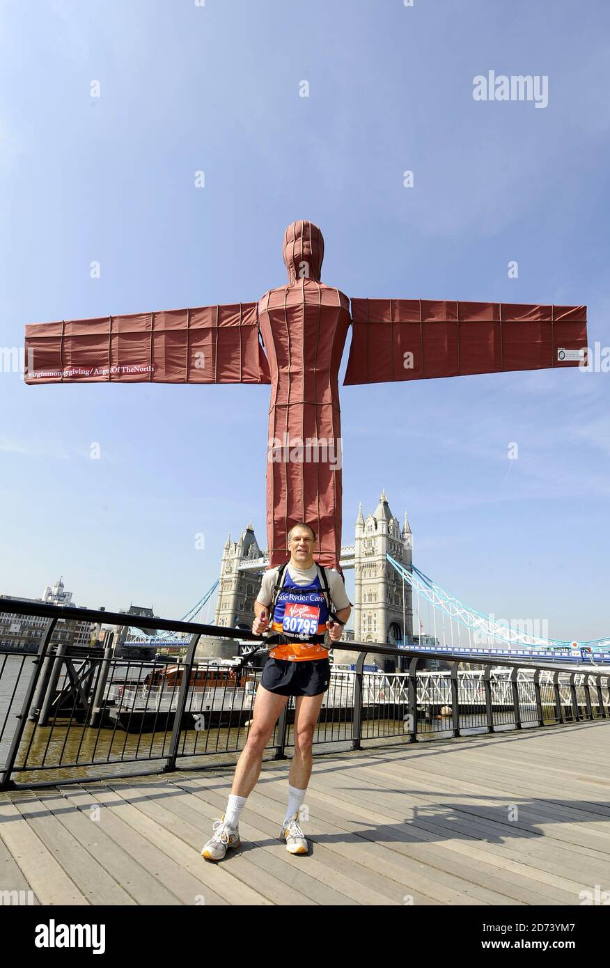 Marathon runner George Bingham poses for photographs in advance of the ...