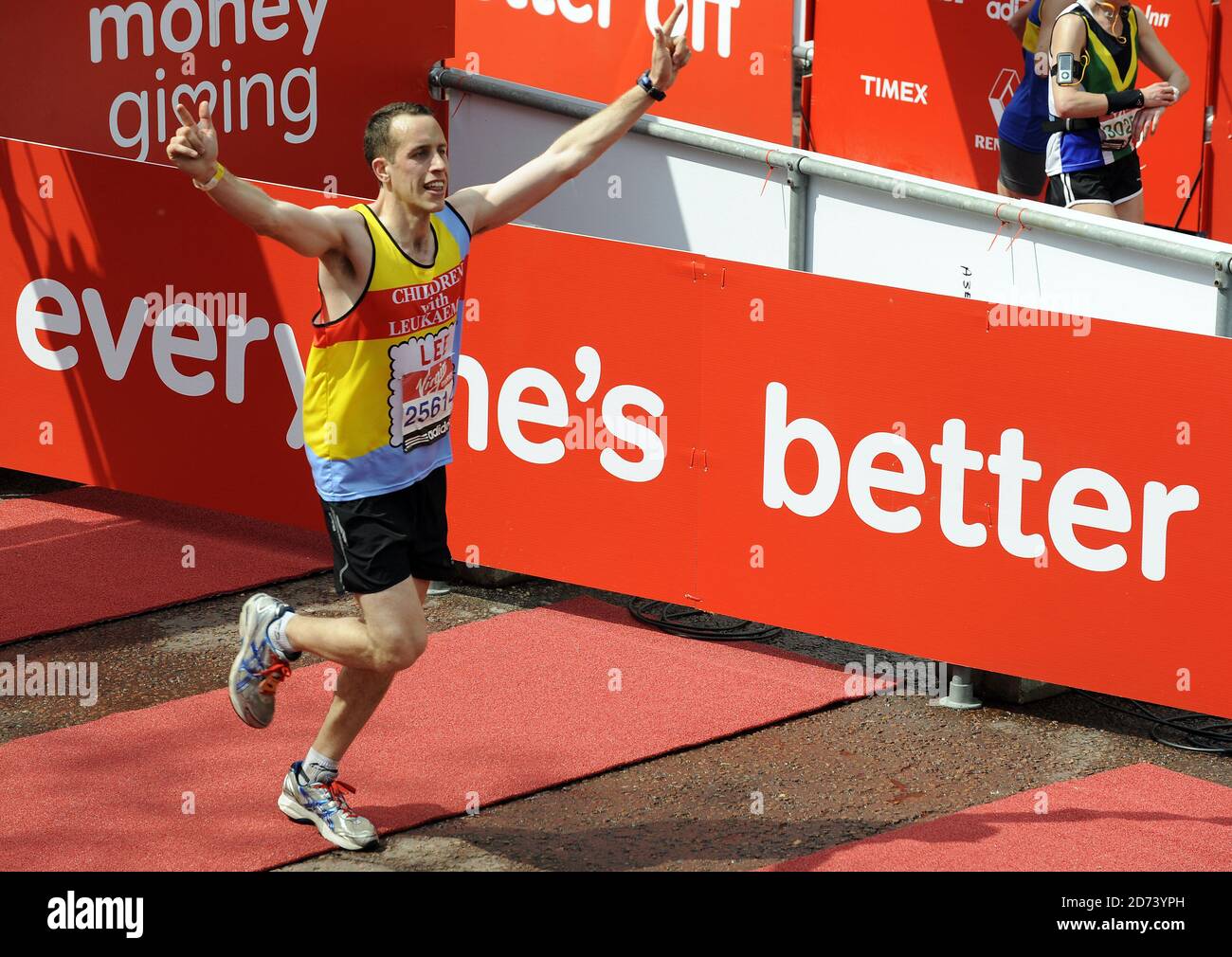 Runners struggle as they finish the 2010 London Marathon, on the Mall ...