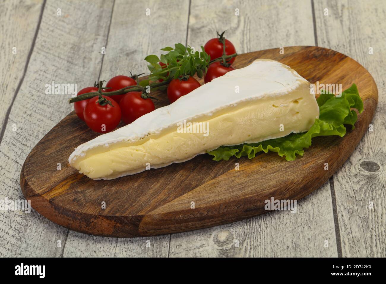 Brie cheese triangle served salad leaves Stock Photo - Alamy