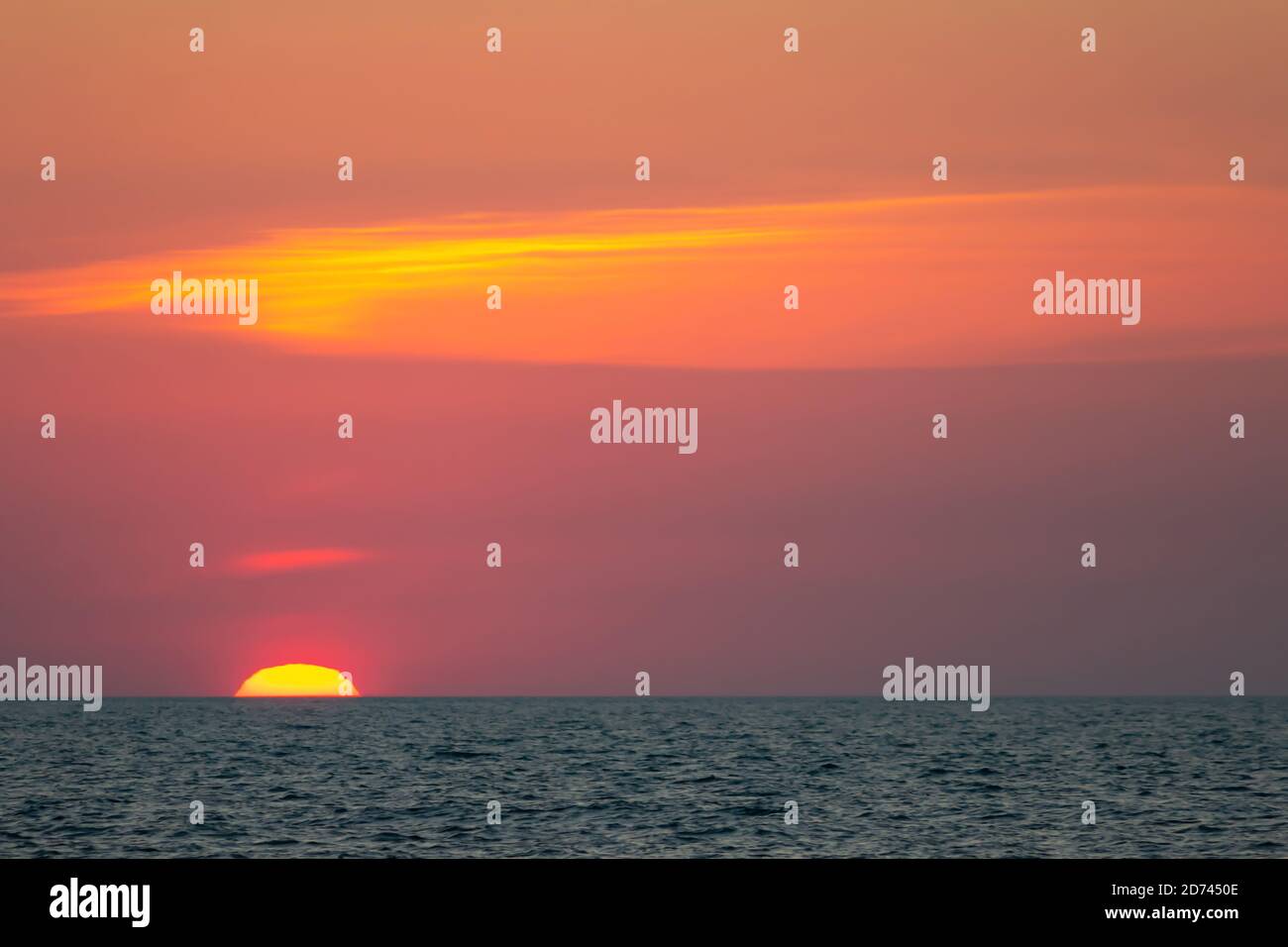 scarlet sunset over the sea Stock Photo - Alamy