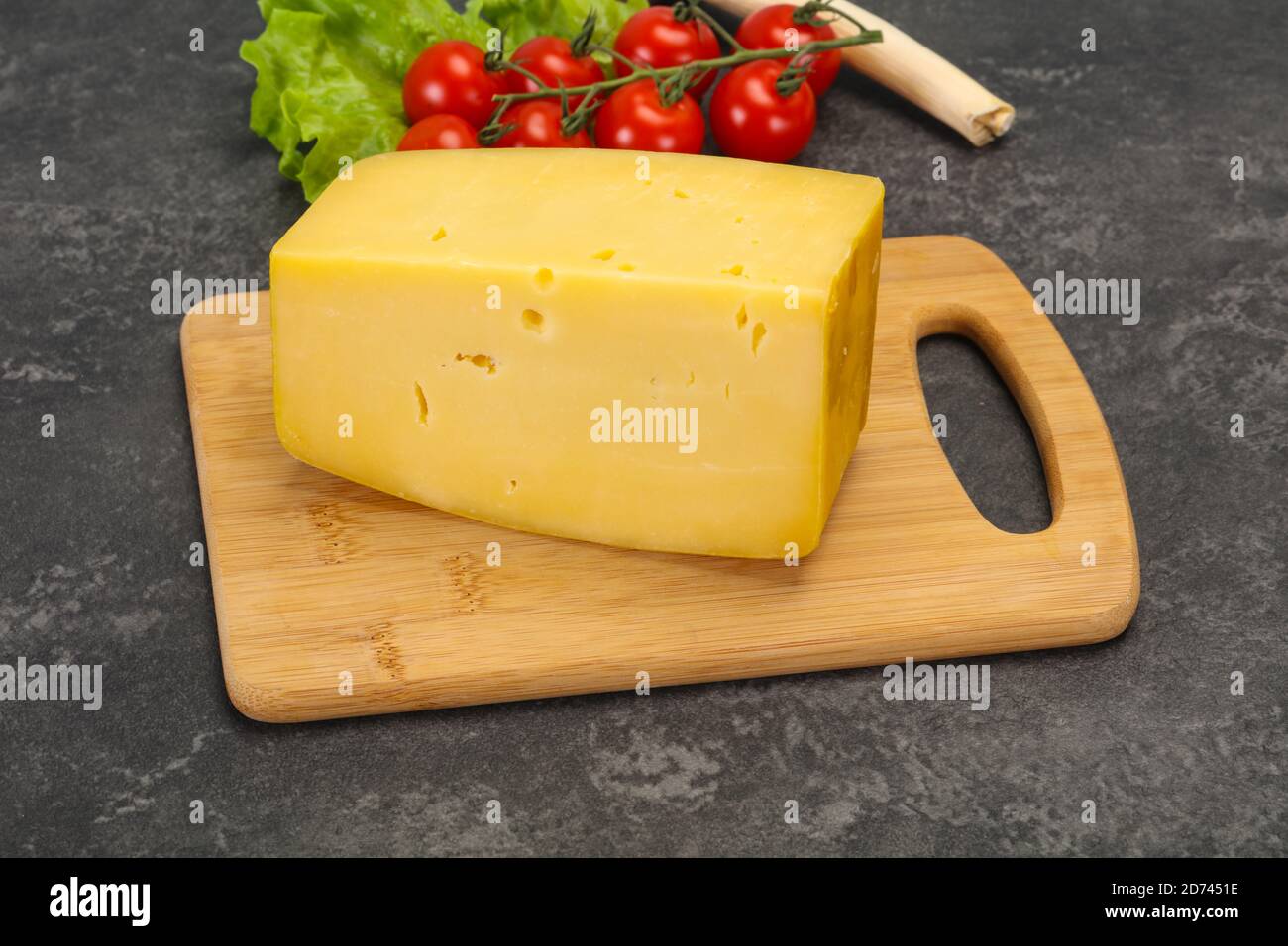 Swiss Hard yellow tasty cheese brick Stock Photo - Alamy