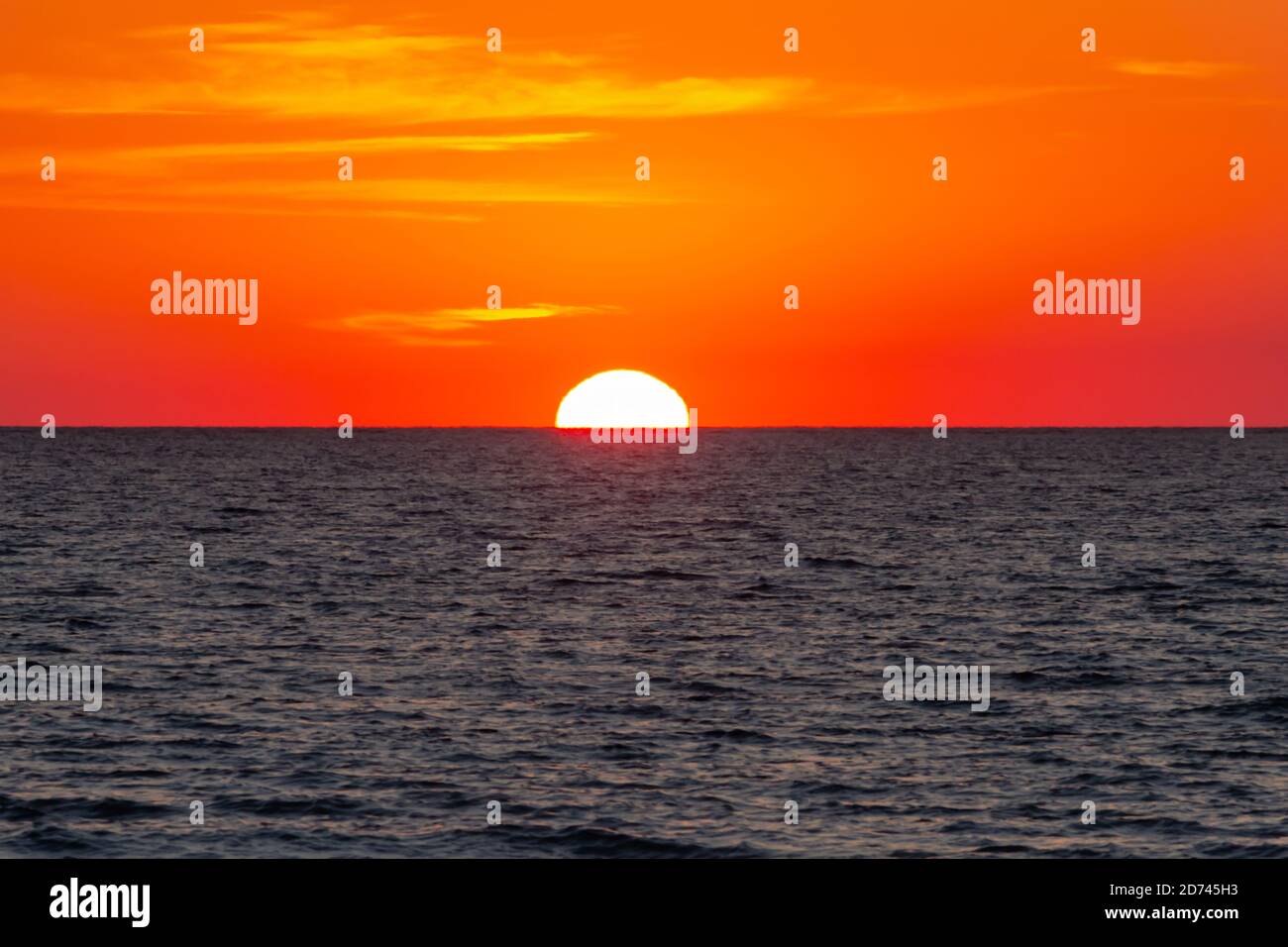 scarlet sunset over the sea Stock Photo - Alamy