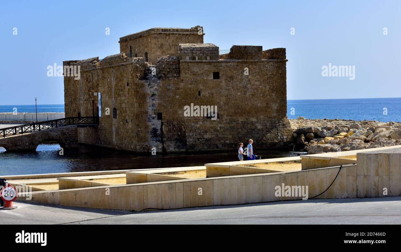 Paphos medieval castle by the coastal broadwalk and Paphos harbour on ...