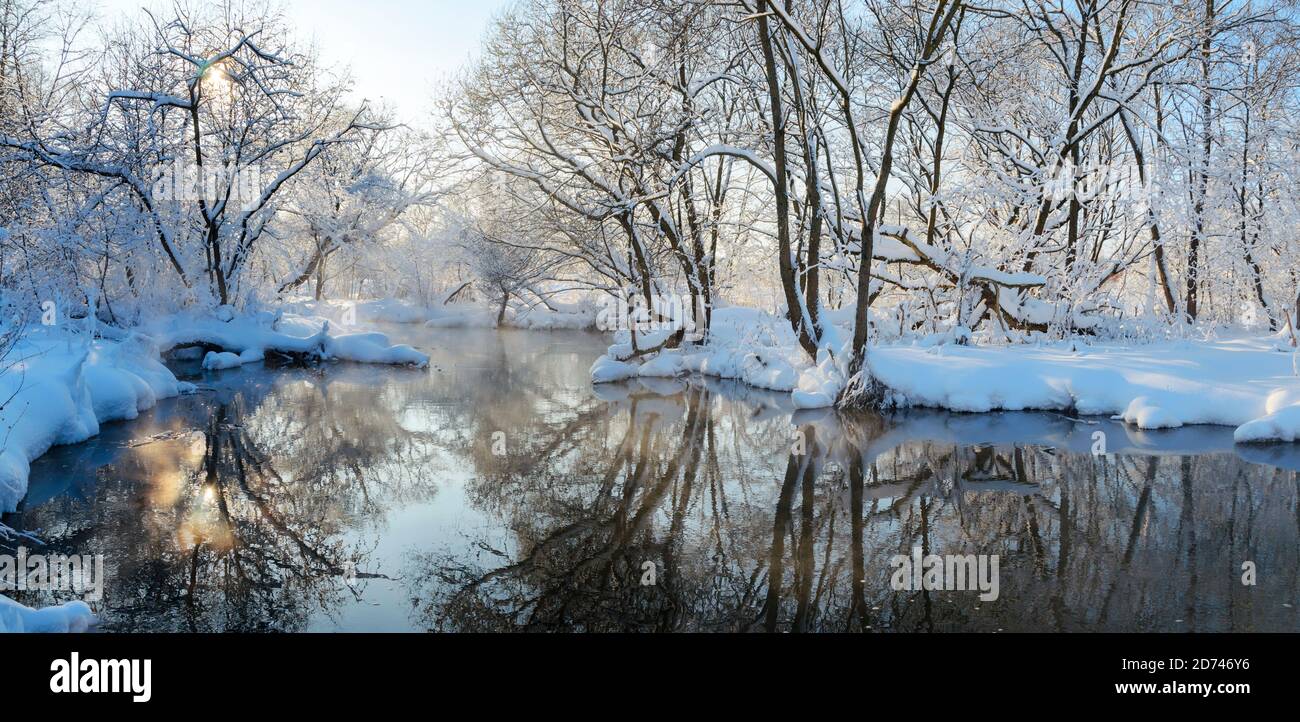 Frosty winter scene with flowing forest river on a sunny morning Stock ...