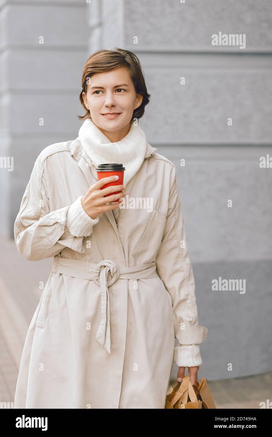 Woman with coffee to go Walk and shopping Stock Photo - Alamy