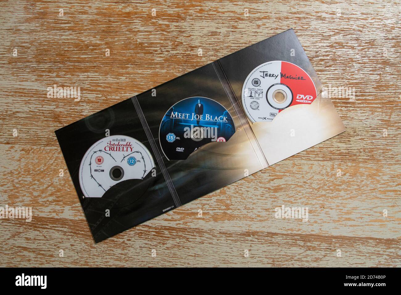 Three feature film DVDs in a fold out holder Stock Photo - Alamy