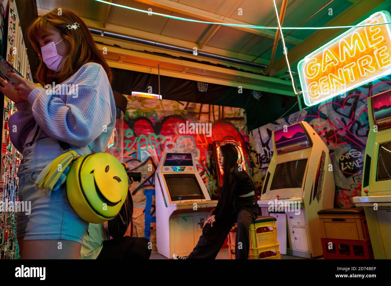 Visitors take photos at an exhibition called 'Heart of Cyberpunk'.The ...