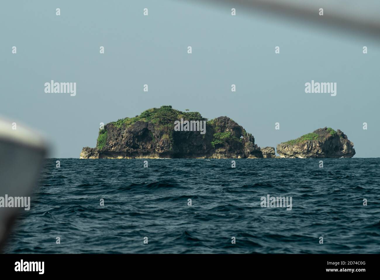 View of two small cliff islets by the Calventuras islands outside ...
