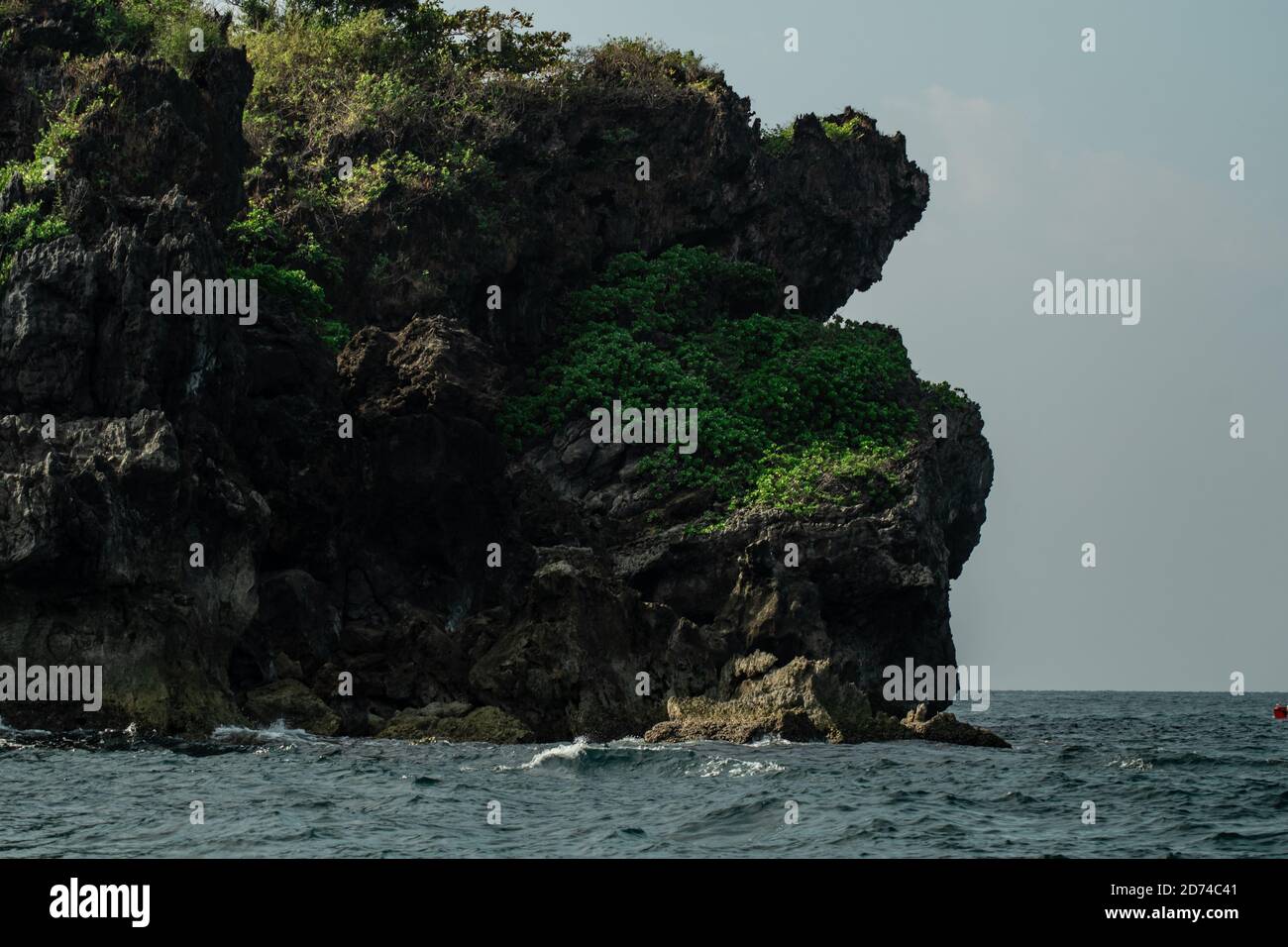 View of a steep cliff with trees growing on it by the Calventuras ...
