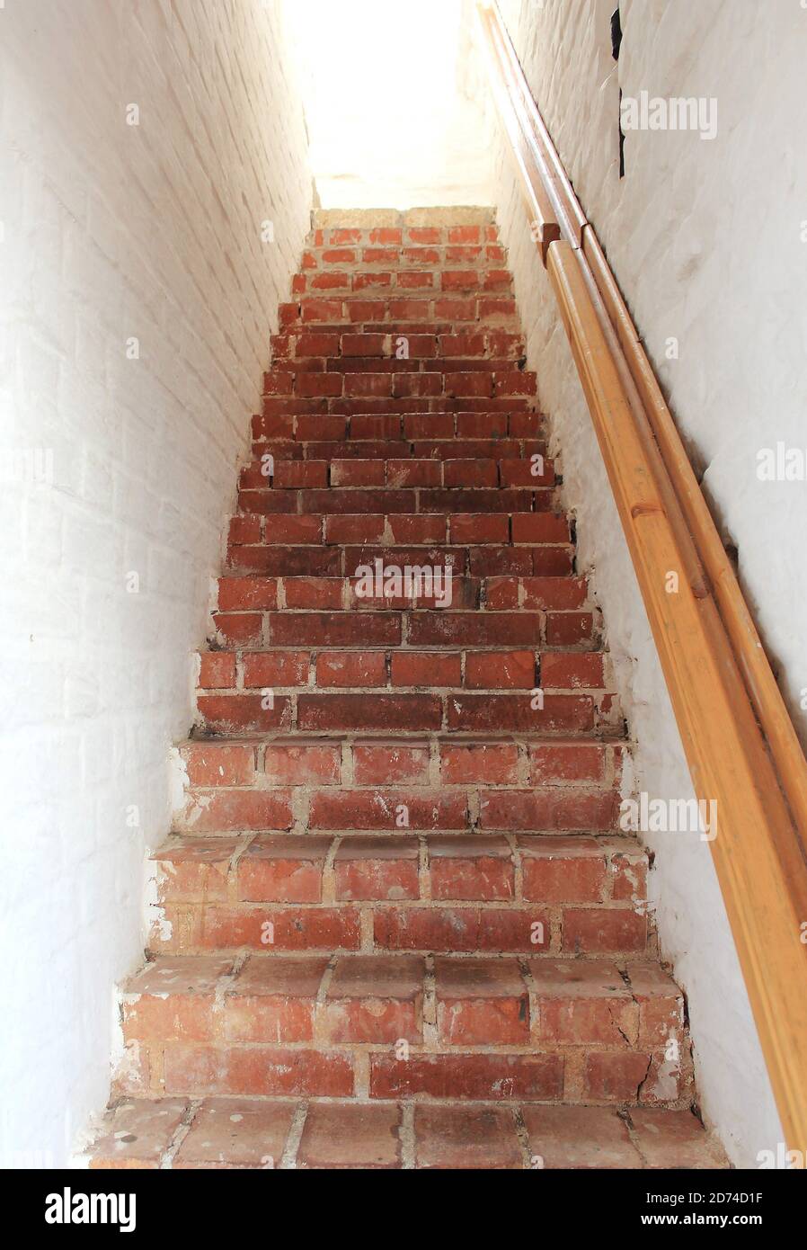 Stone narrow staircase up in an ancient brick building Stock Photo - Alamy