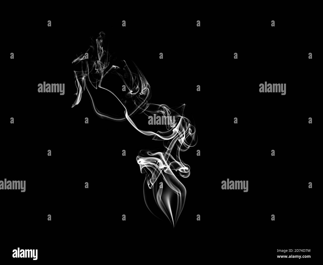 Abstract white puffs of smoke swirls overlay on black background ...