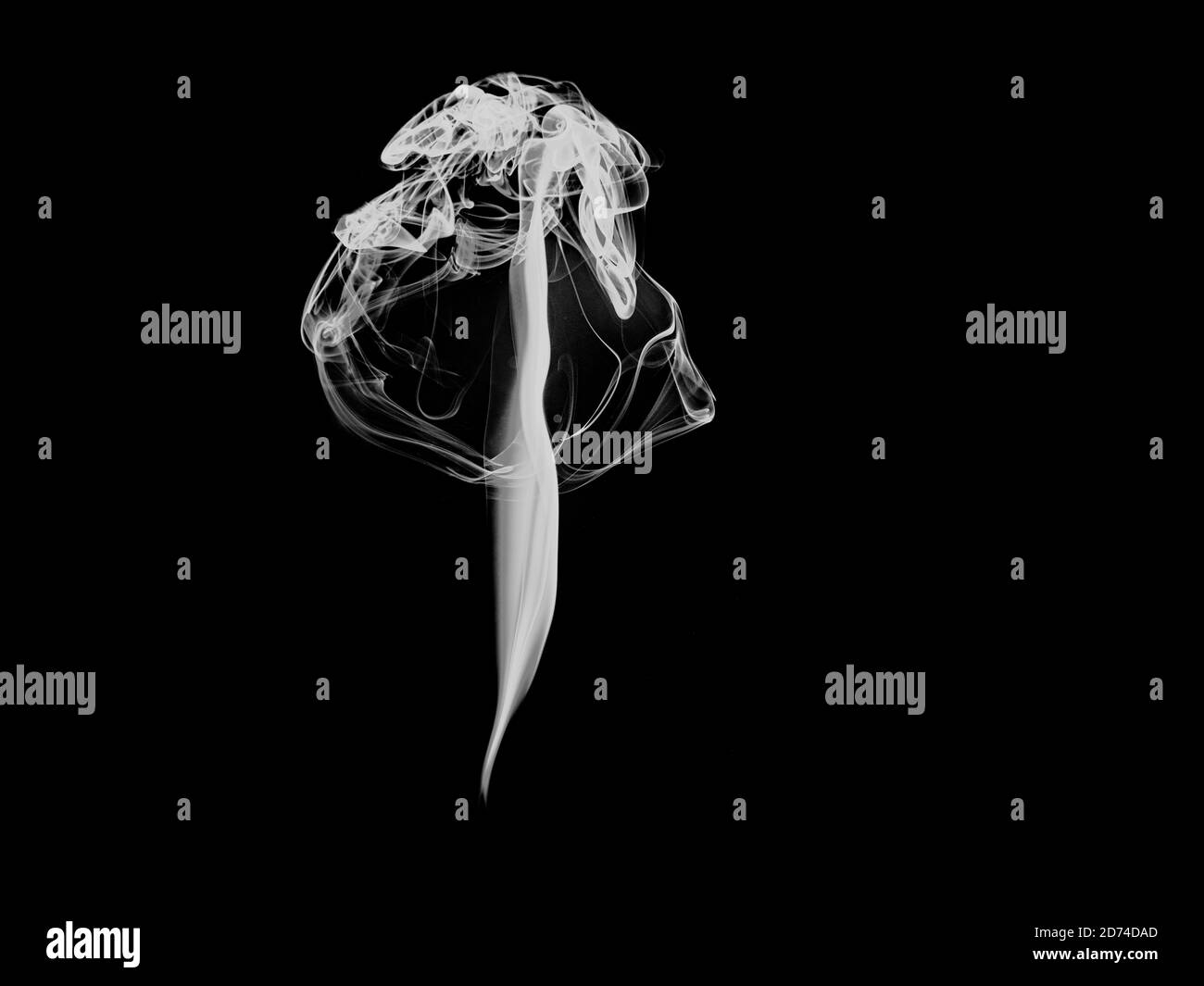 Abstract white puffs of smoke swirls overlay on black background ...