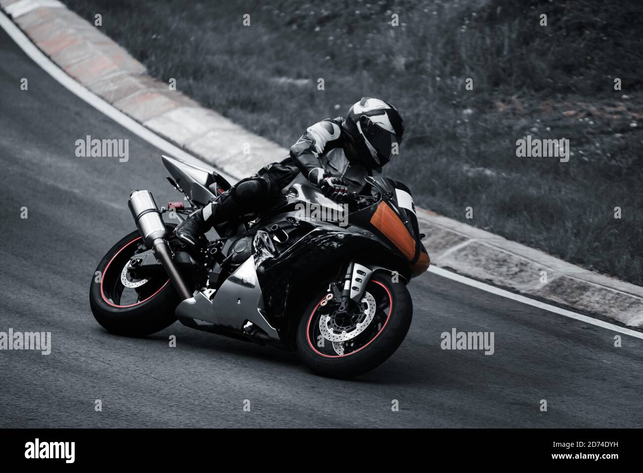 man riding motorcycle in asphalt road. Motorcyclist at sport motorcycle ...