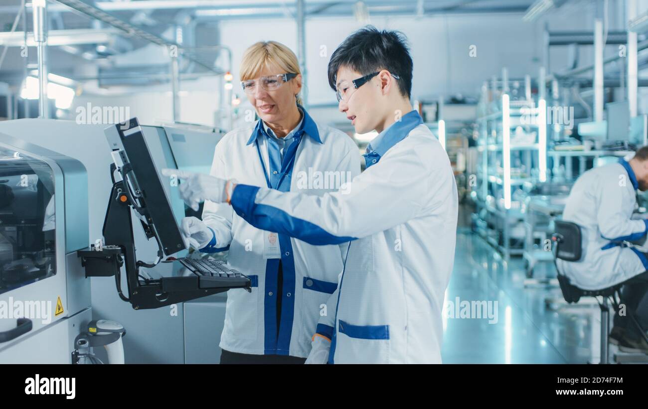 Asian plant supervisor talking on hi-res stock photography and images ...