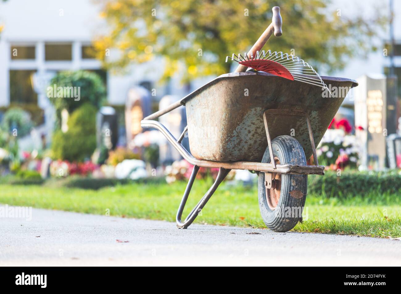 Close up of grey wheelbarrow in a park, gardening Stock Photo - Alamy