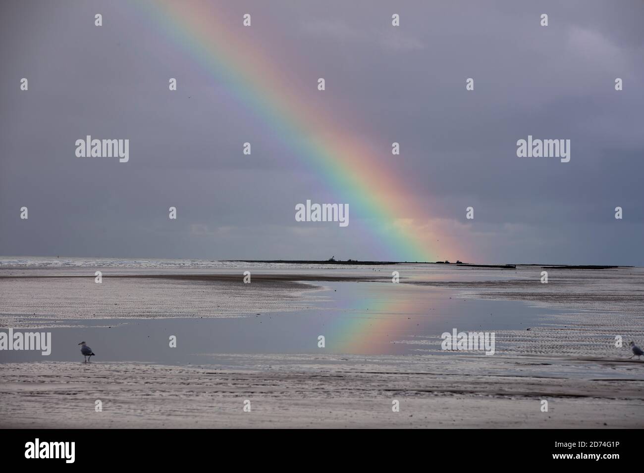 Rainbow between dark clouds hi-res stock photography and images - Alamy
